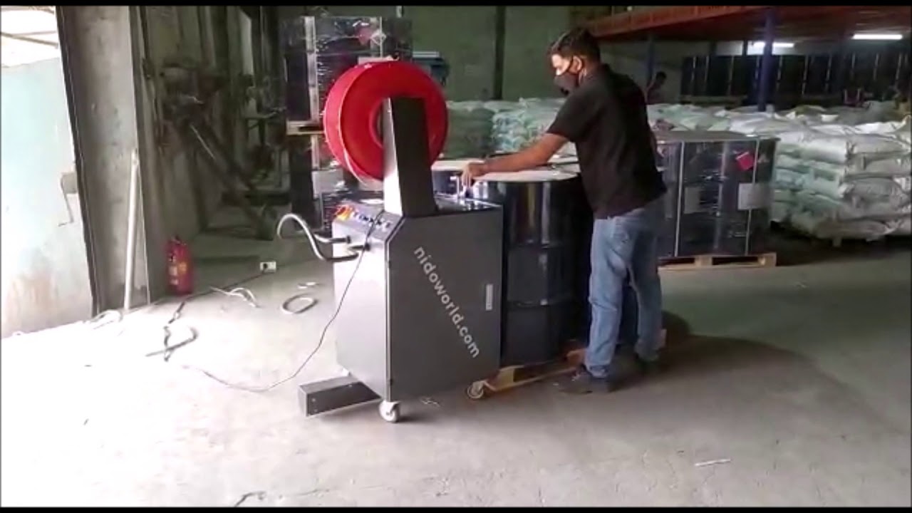 "Efficient Drum Pallet Strapping Solution for Streamlined Packaging Process" - orbital stretch ...